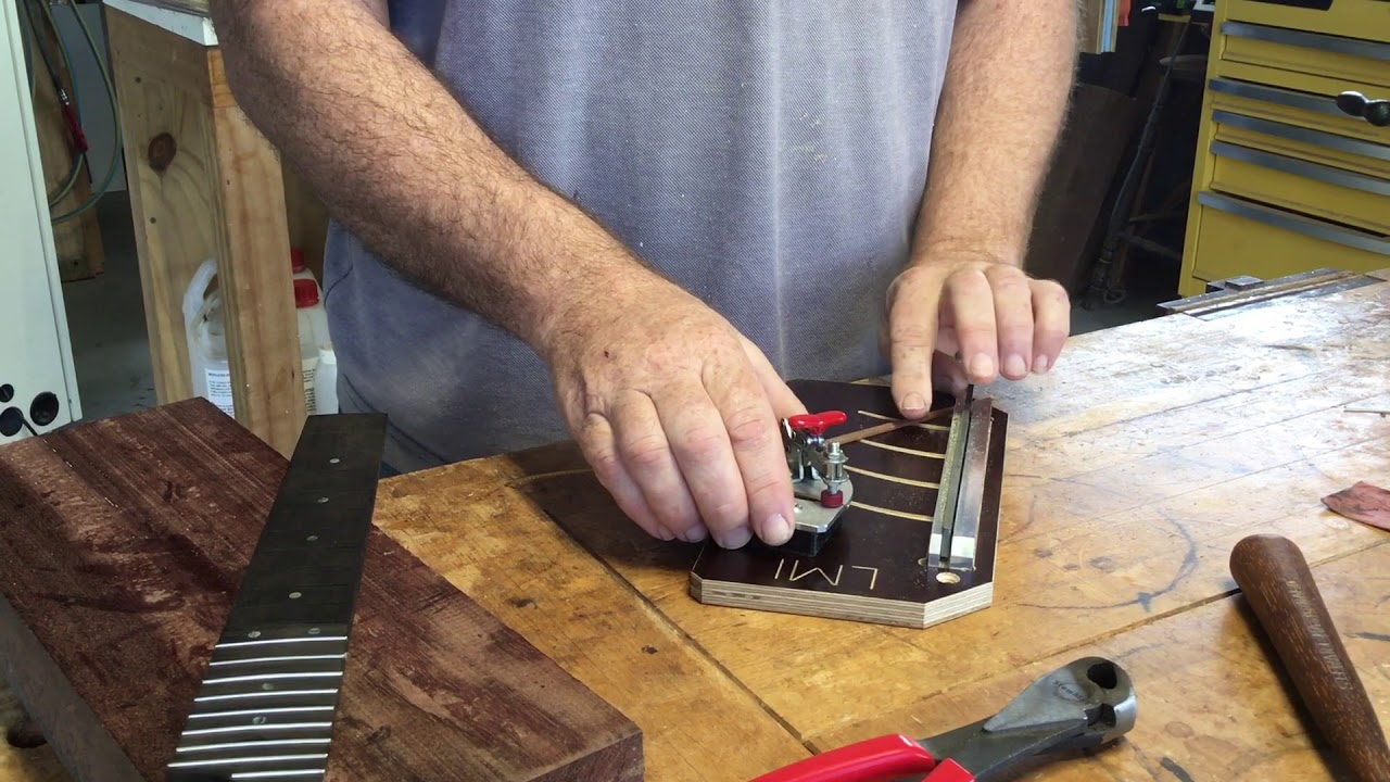 Trimming fret tangs to fit a fret board. - YouTube