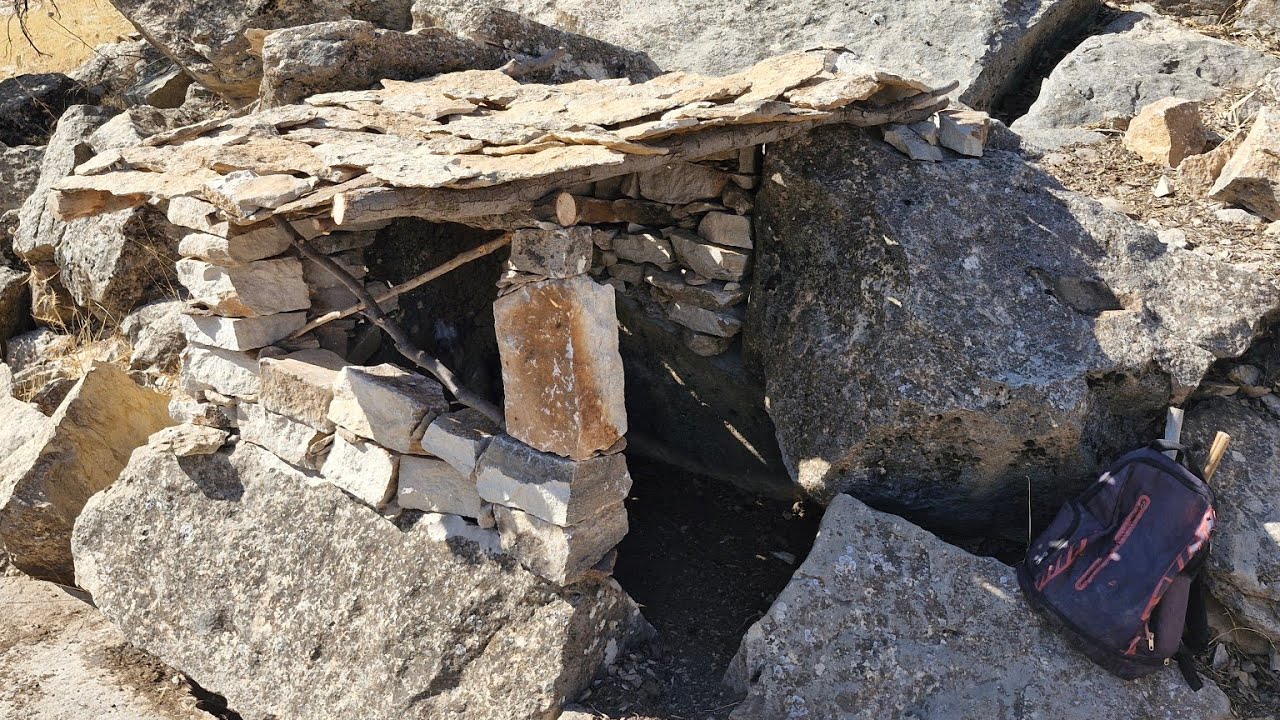 Construction of a warm and stone shelter next to the rocks | How to ...