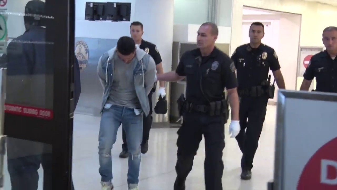 Perp walk time Man arrested by LAX Airport police TSA checkpoint for ...