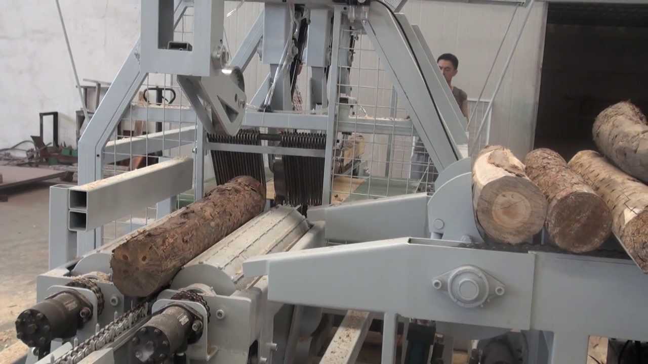 Log bilateral cutting sawing machine - YouTube