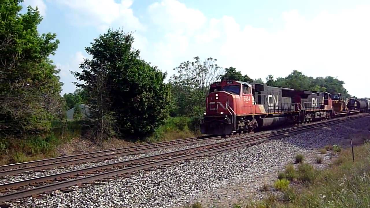 Caterpillar construction equipment on TTX HTTX Flat Cars. - YouTube