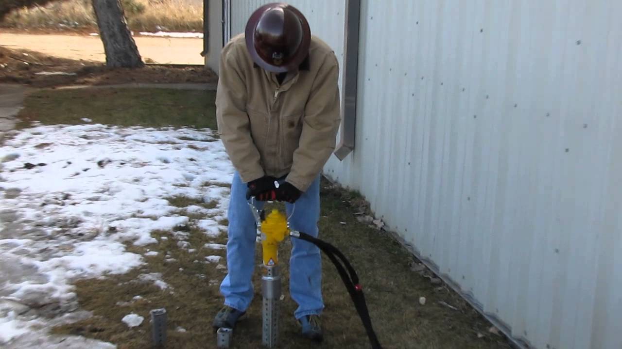 Post Driver driving a Telespar® post - YouTube