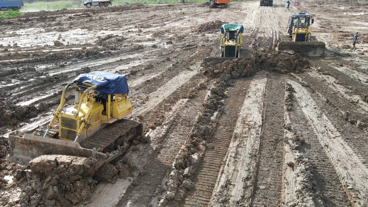 Amazing Bulldozer moving wetland for filling up in water area | Machine ...