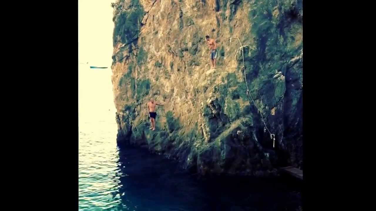 Cliff diver in La Grotta Bar, Corfu - YouTube