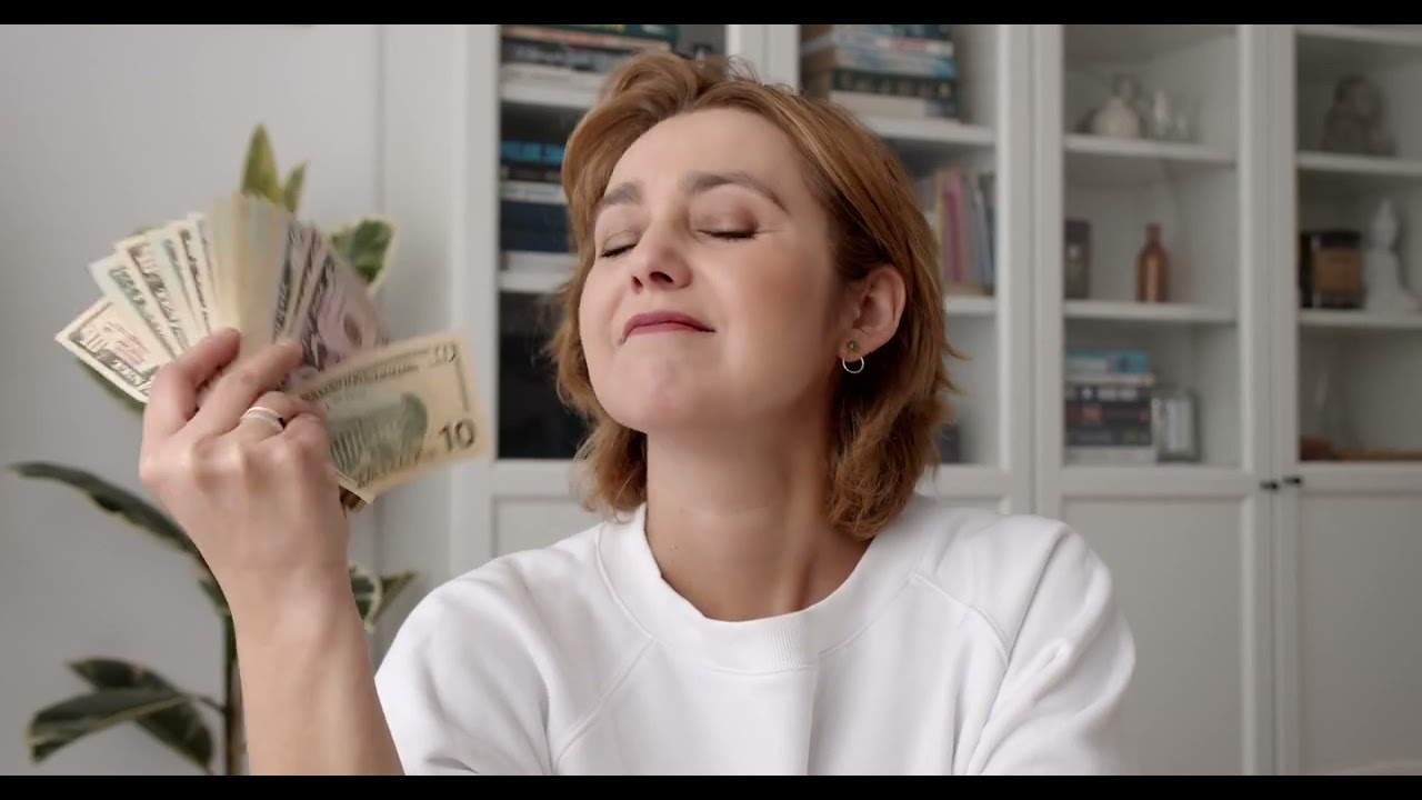A Woman Fanning Herself With Money - YouTube