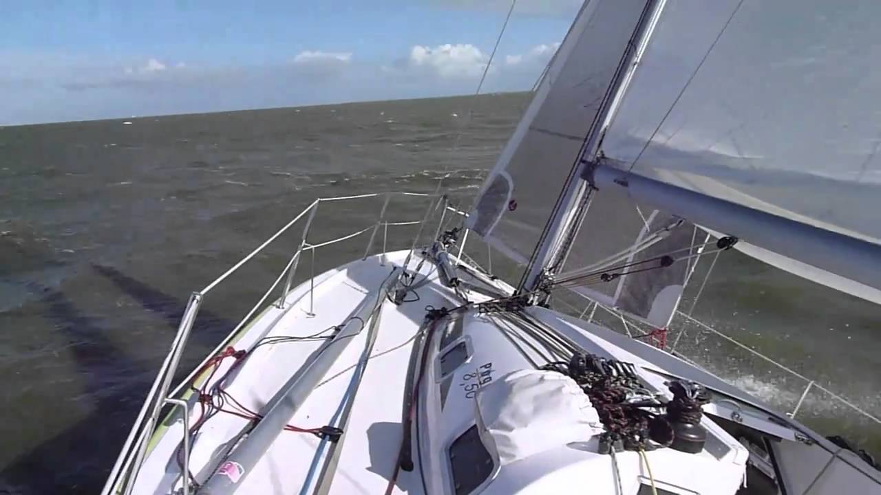 Sailing upwind in 22 knots wind on a pogo 850 - YouTube