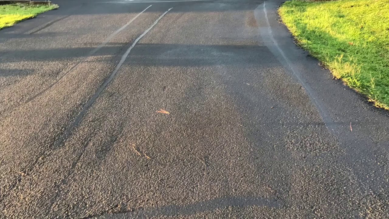 Sealcoating and line striping - YouTube