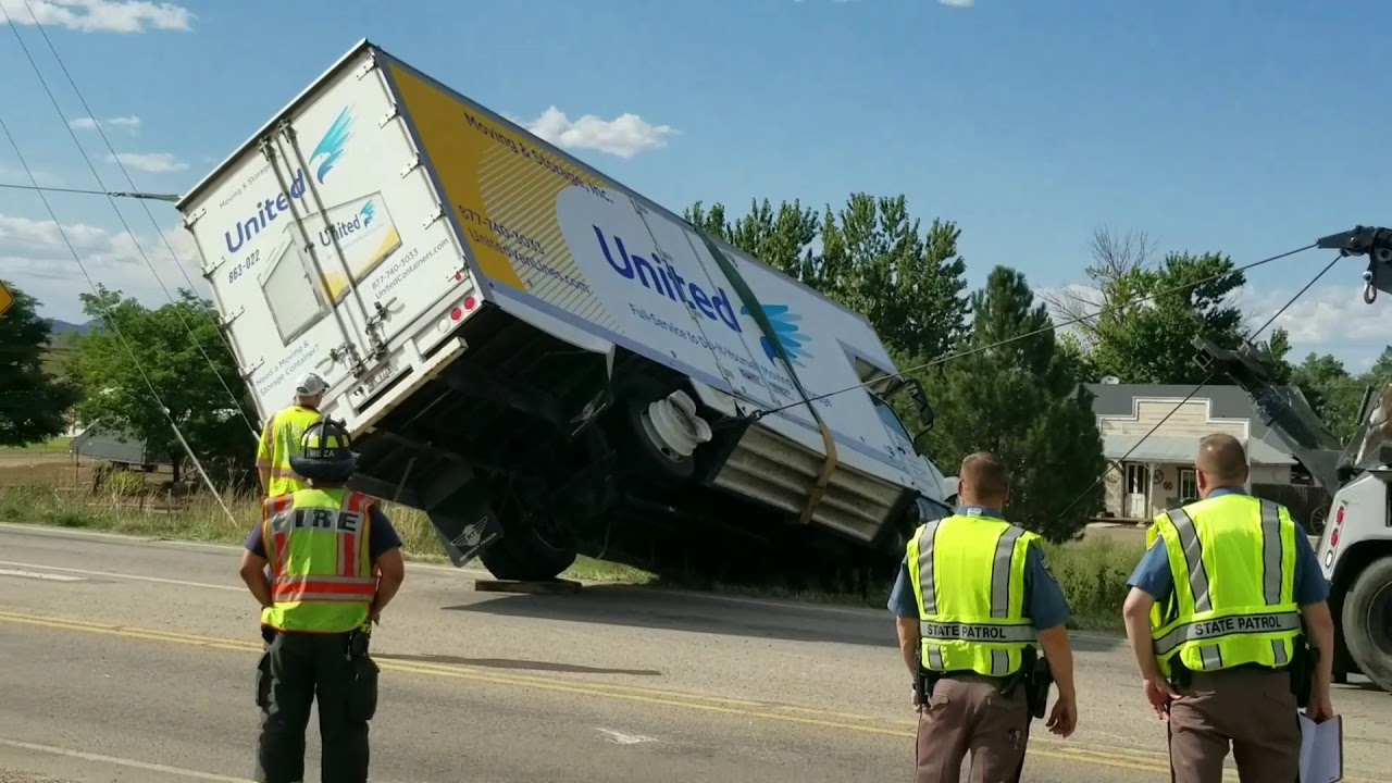 Moving Truck on it's side gets back on it's wheels - YouTube