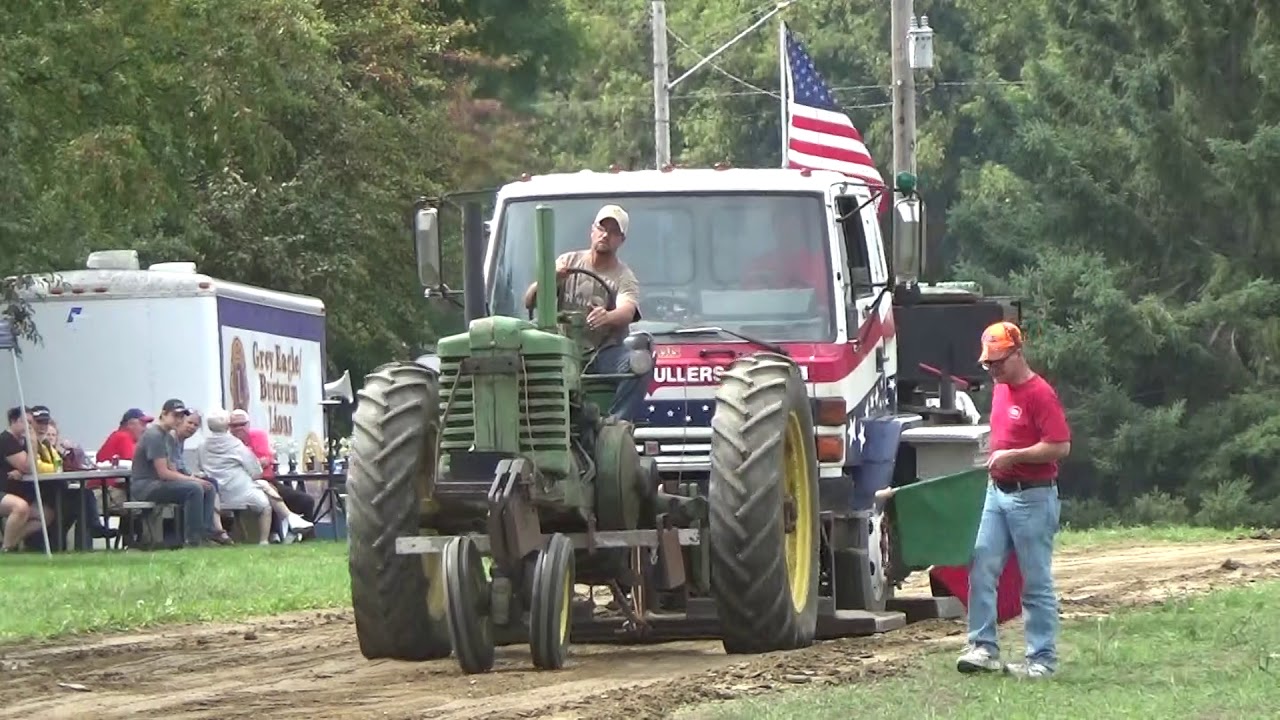 John Deere G pulling in Grey Eagle - YouTube