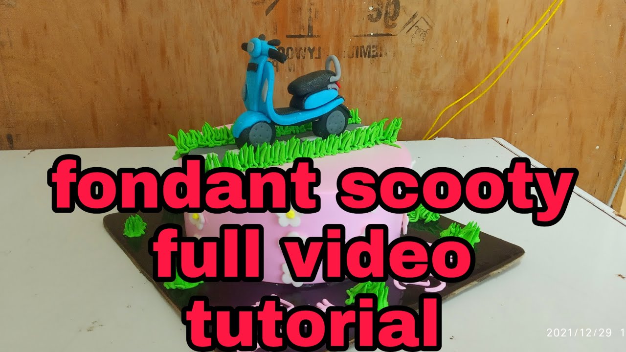 A #scooty cake topper, #Vespa cake , scooter theme .#blue scooty cake ...