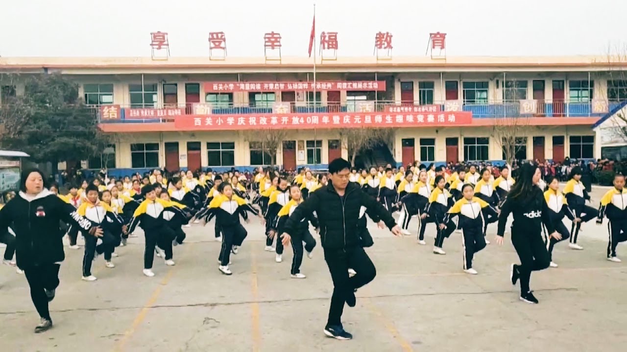 Watch: China school principal joins students for shuffle dance - YouTube