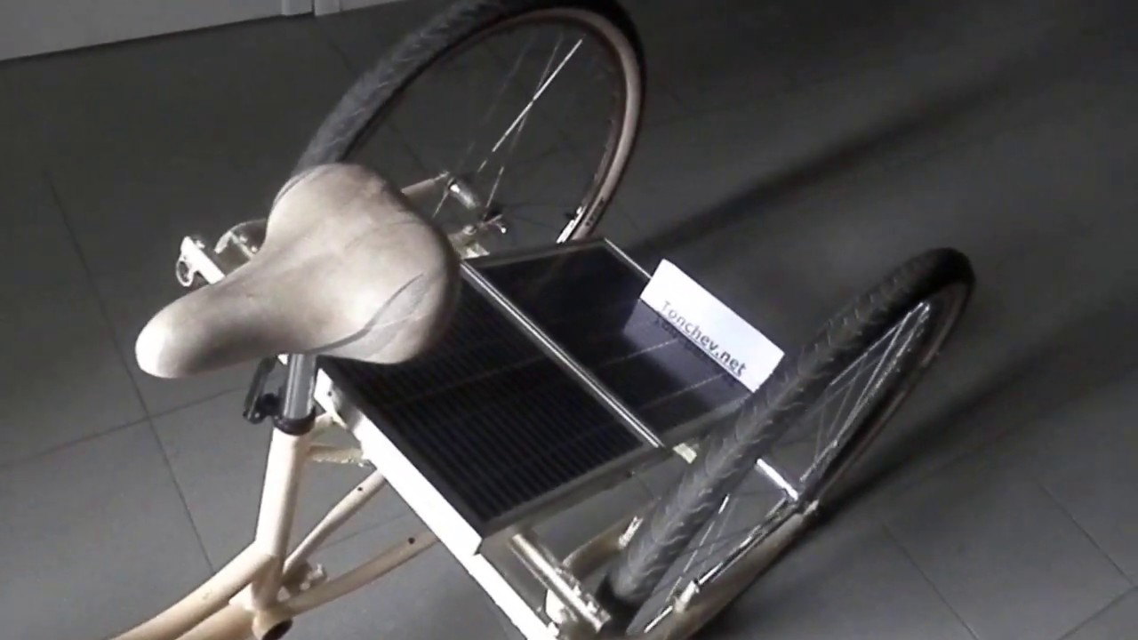 Solar photovoltaic panels powered front pedal driven tricycle with ...