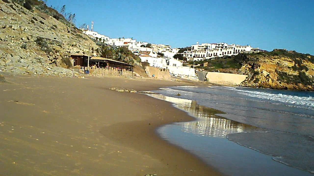 Beach and beach bar of Burgau, West Algarve, Portugal. December 2011 ...