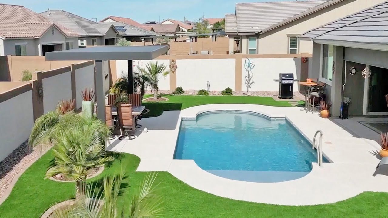 Artificial Turf and Pavers Installed around swimming Pool - YouTube