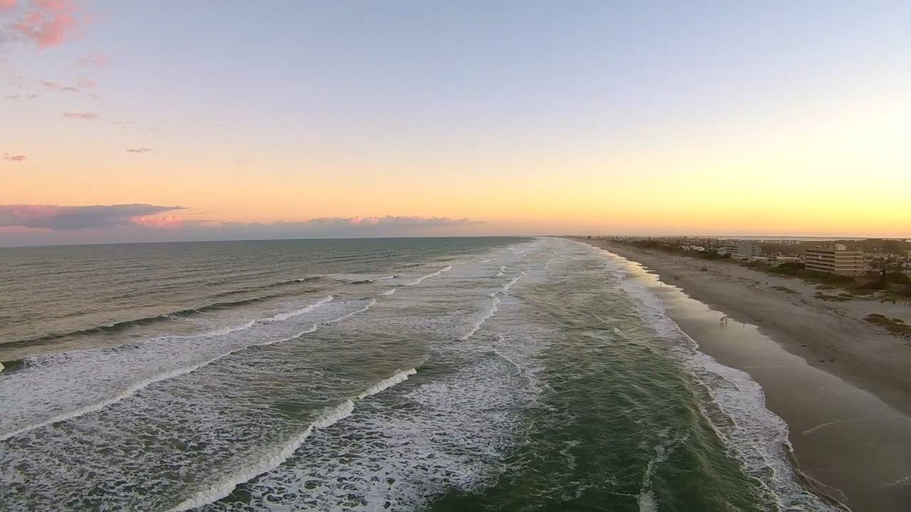Over the Sea and High Above Cocoa Beach at Sunset Aerial Video - YouTube