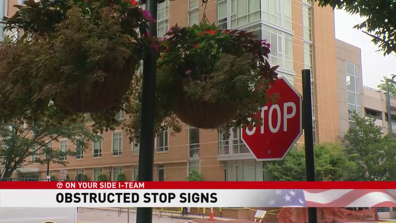 Obstructed stop signs make intersections hazards at Reston Town Center ...