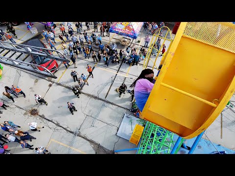 A Little Girl Stuck at The Top of a Ferris Wheel