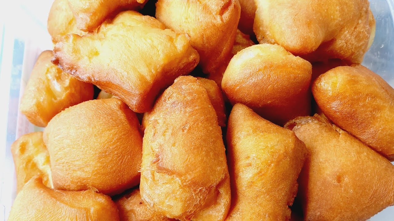 cooking mandazi for my inlaw in the village - YouTube