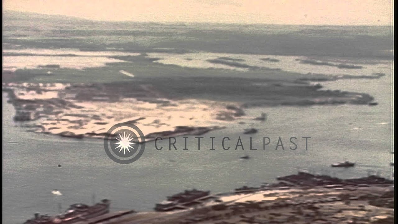 Aerial view of naval base and submarines underway in the Pearl Harbor ...