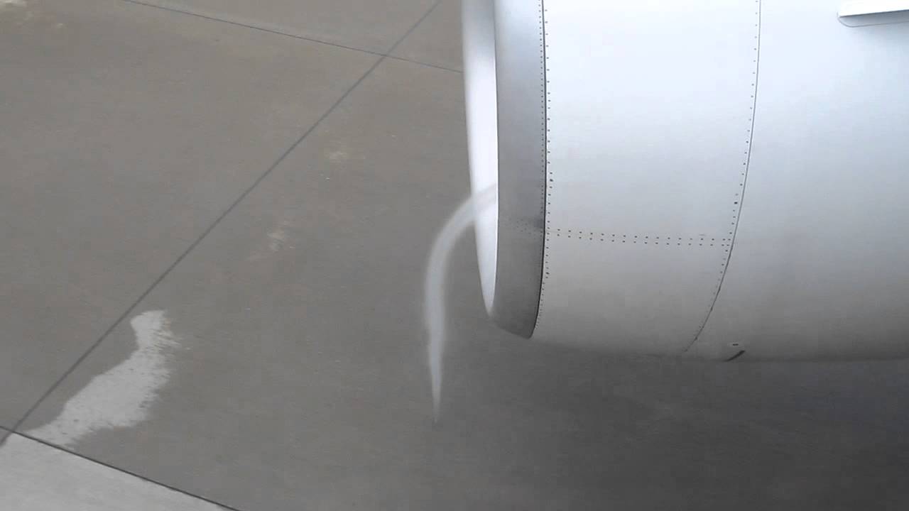 Airplane Engine sucks water on damp taxiway - YouTube