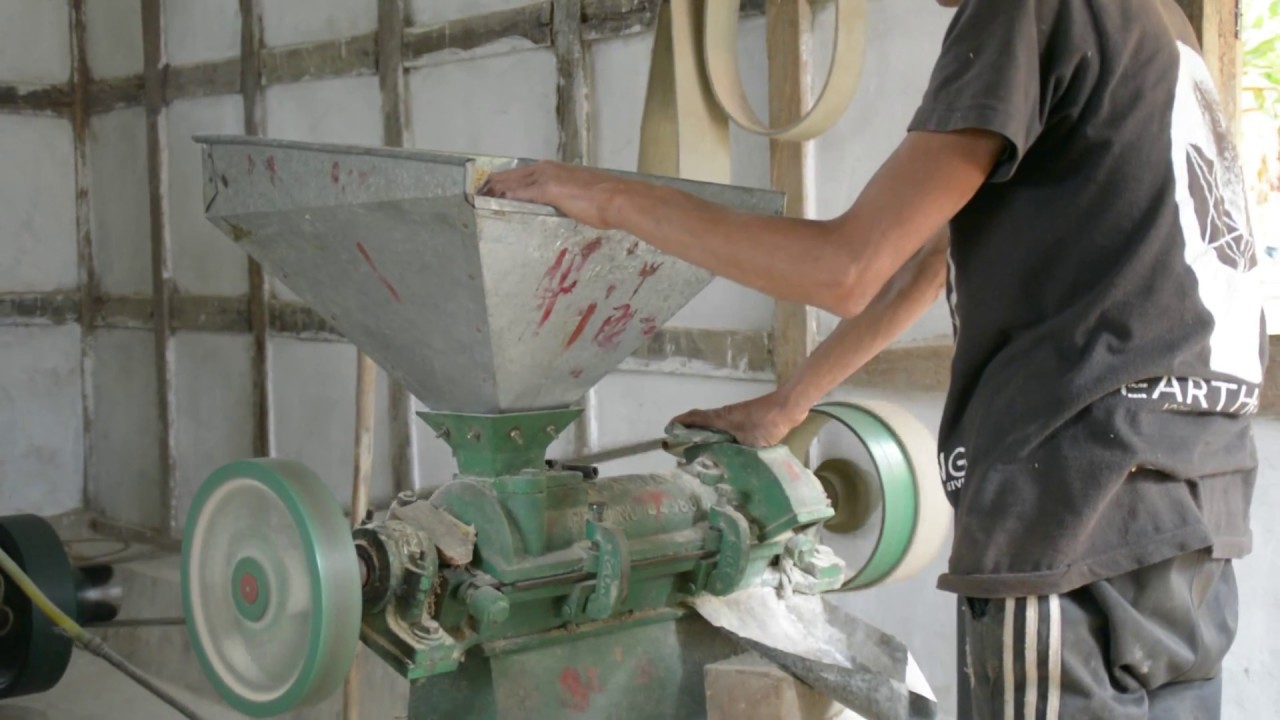 Dehusking Rice - YouTube