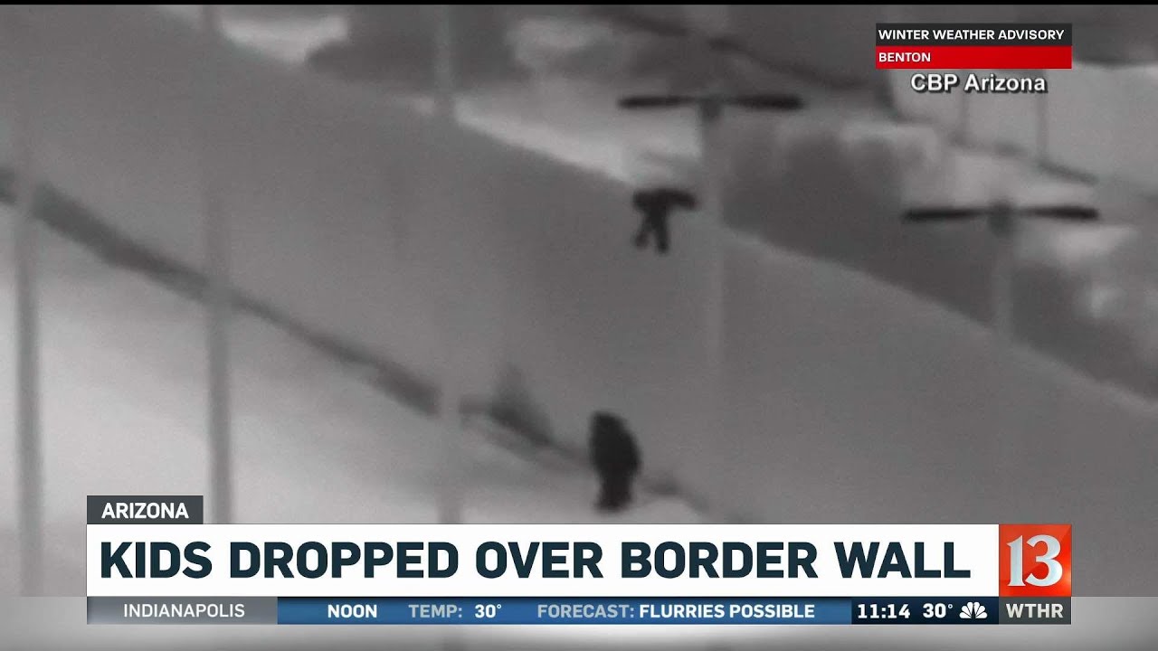 Kids dropped over border wall - YouTube