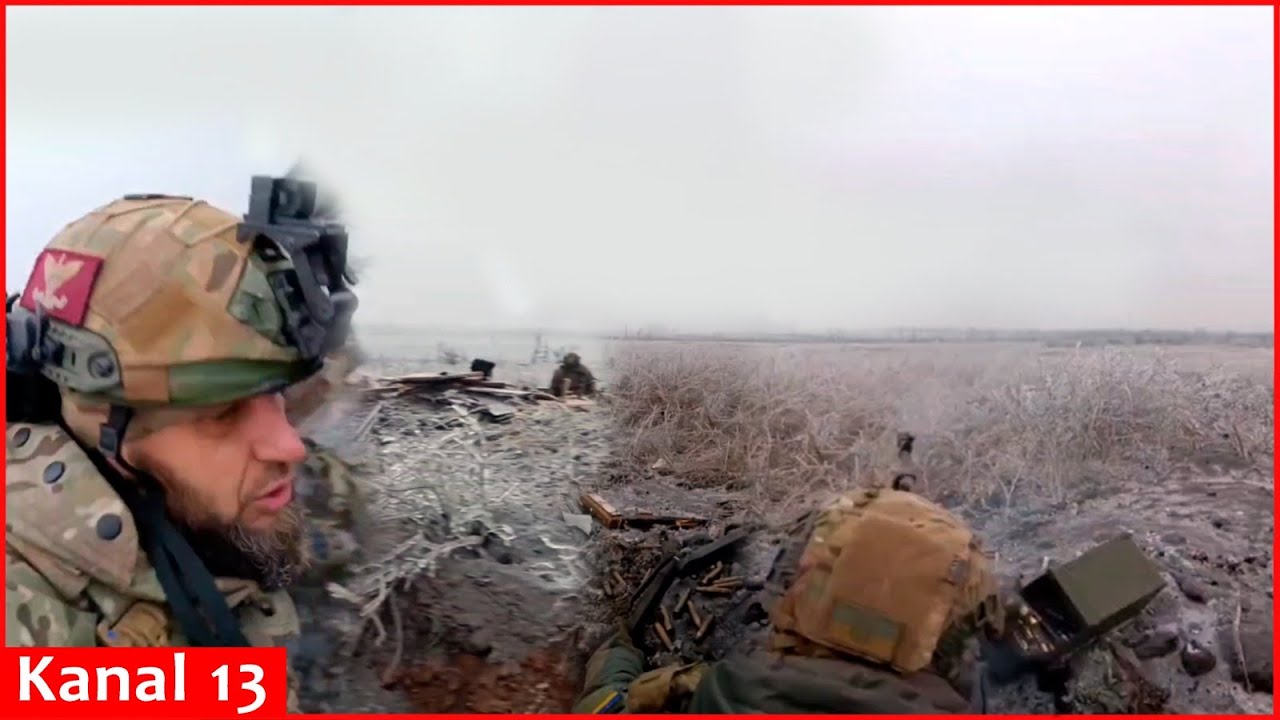Ukrainian soldiers confront invaders with small arms in a snowy trench ...