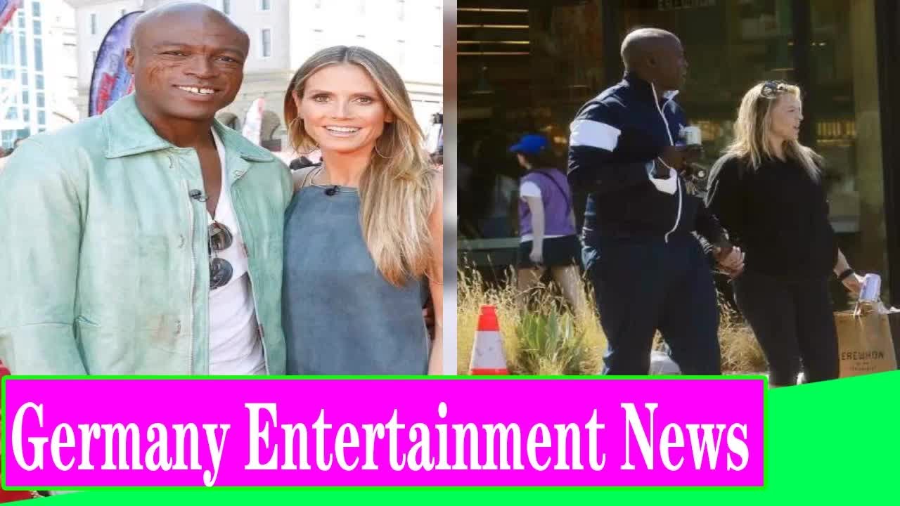 Seal holds hands with girlfriend Laura Strayer on a rare public outing ...