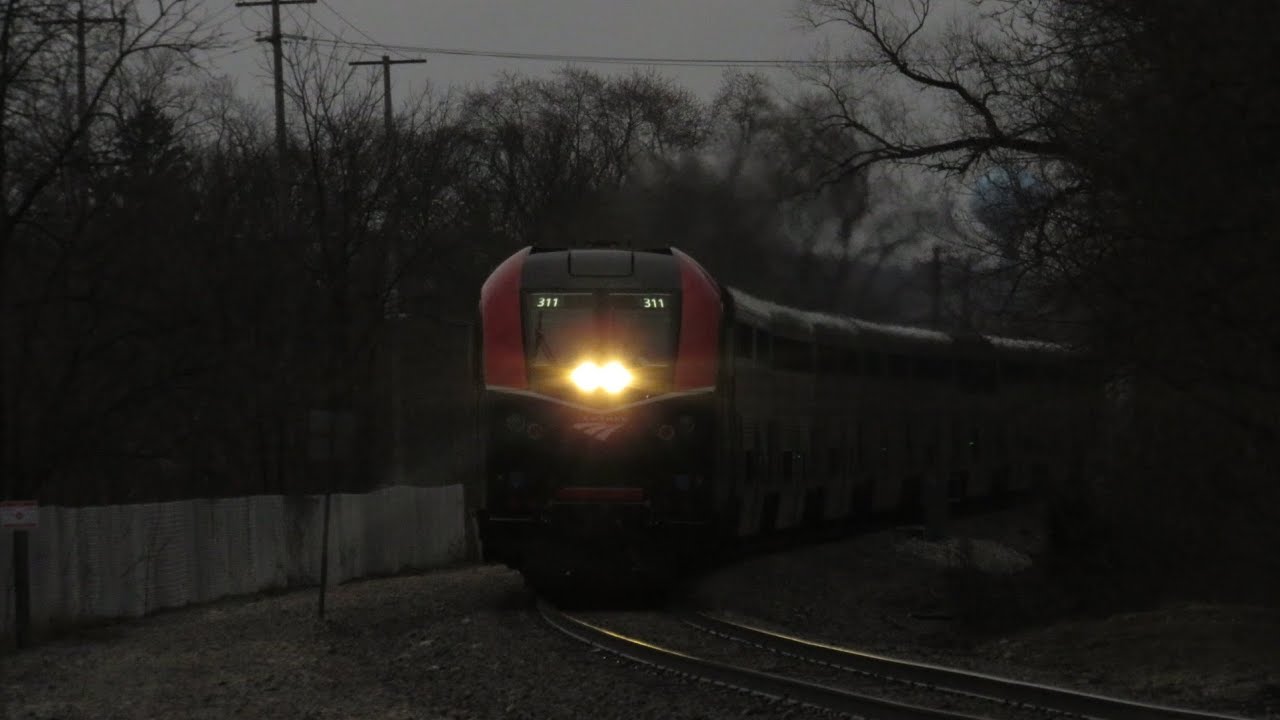AMTK 311 leads AMTK 8 thru Pewaukee Lake, WI on the Canadian Pacific ...