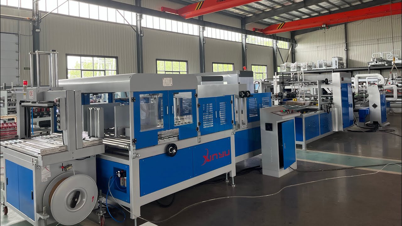 AFG Automatic folder gluer and PP strapper machine - YouTube