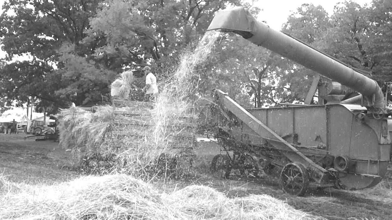 A steam engine working a thrashing machine. - YouTube