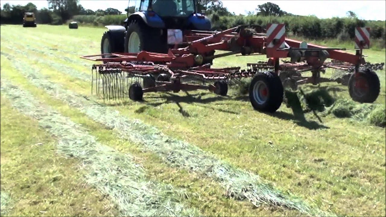 Round bale silage. Mowing and raking - YouTube