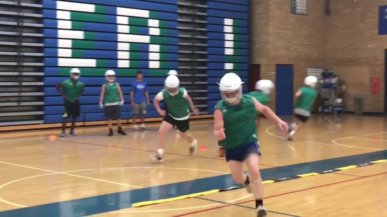 Scenes from day one of high school football practice - YouTube