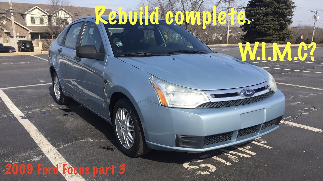 Completing the rebuild on the crashed Focus after paint - YouTube
