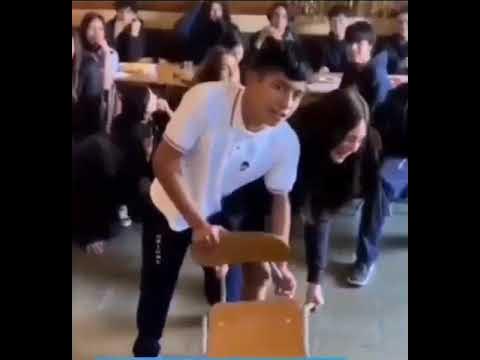 Two students fight over a chair while playing musical chairs - YouTube