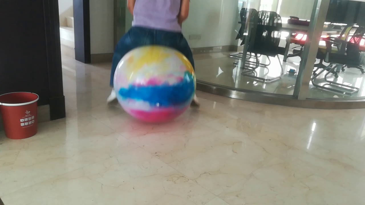 Bouncing on a colorful space hopper ball - YouTube