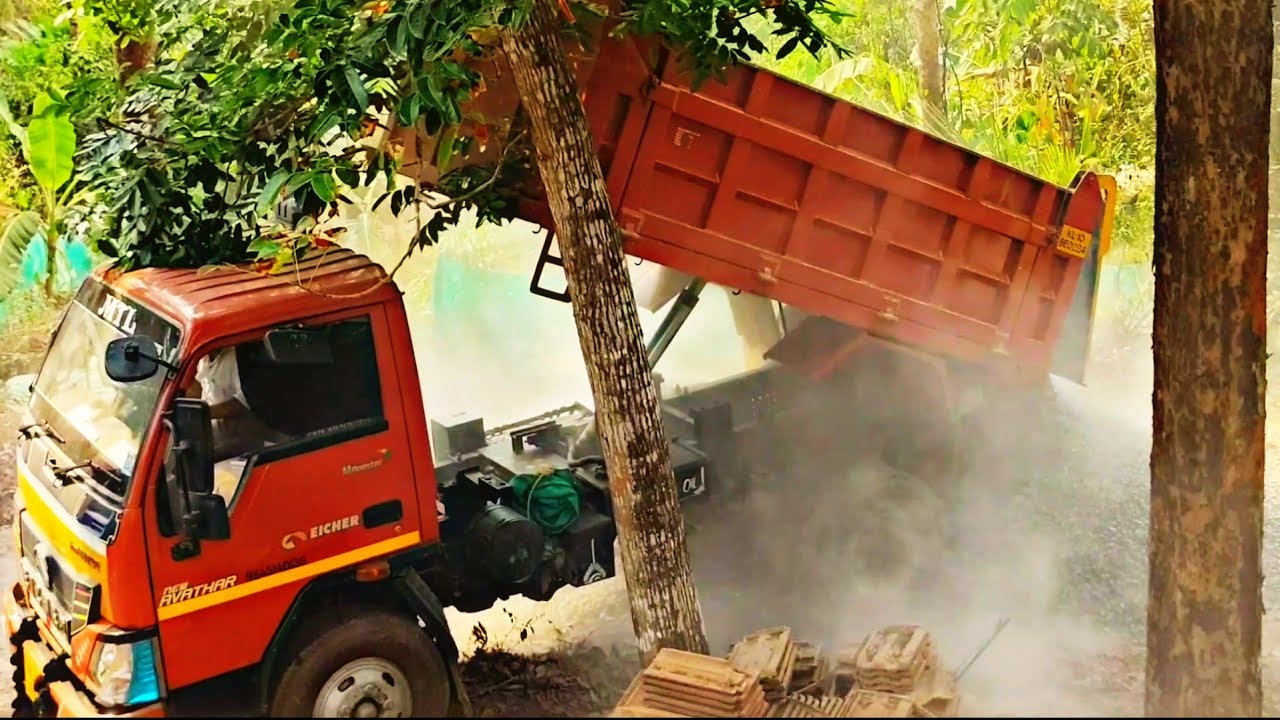 A pickup truck unloading concrete metal on a steep incline #unloading # ...