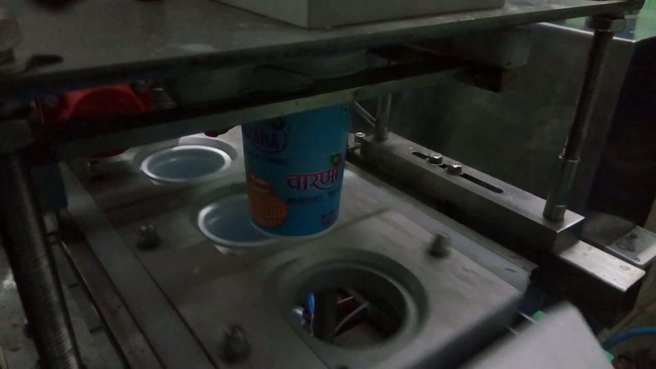 Curd cup filling and sealing machine - YouTube