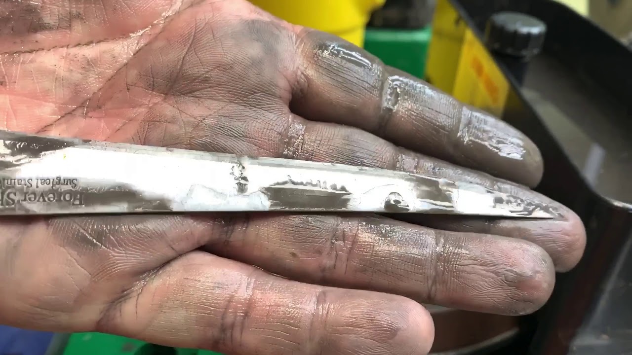Sharpening a slicing knife on a rotary whetstone setup. - YouTube