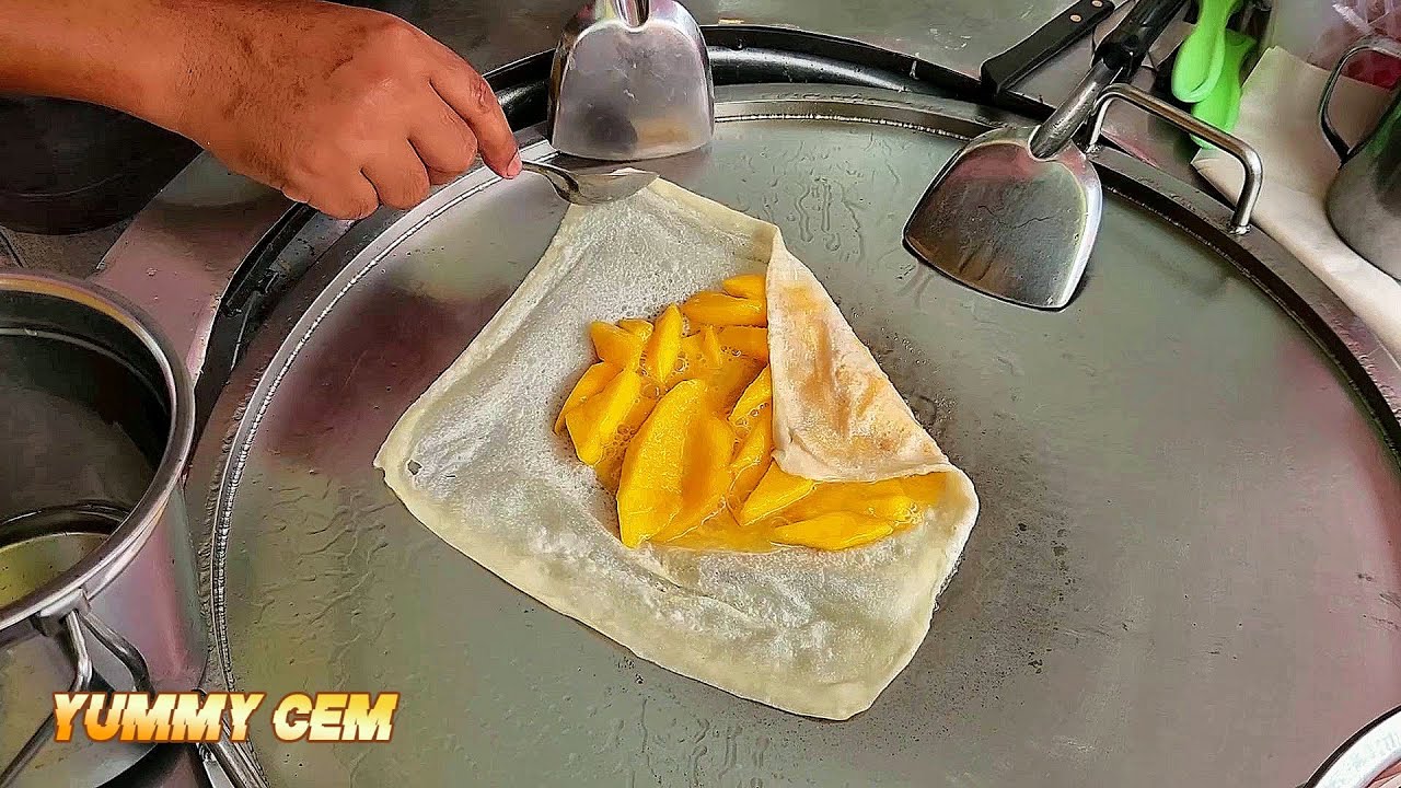 Roti with different fillings (coconut, mango, banana). Asian street ...