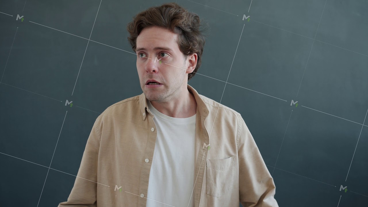 Slow motion portrait of stressed young man screaming and flapping arms ...
