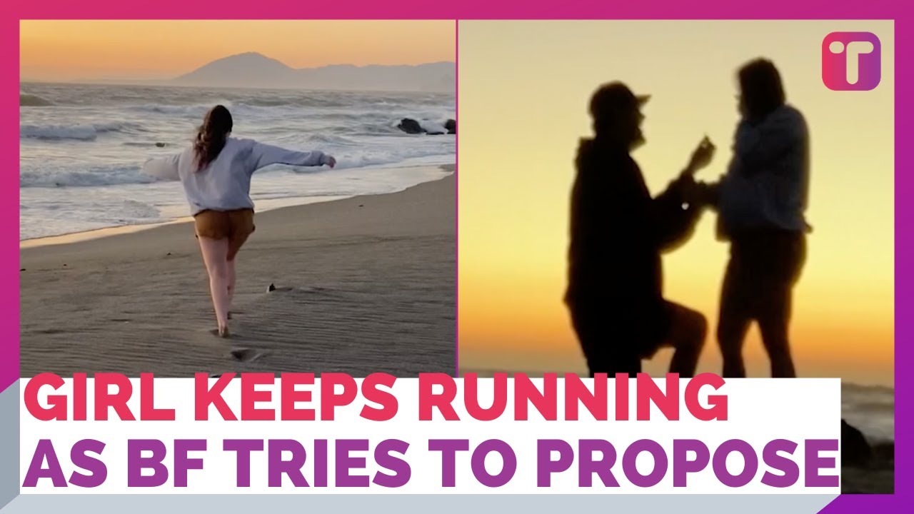 Girl Keeps Running Away As Boyfriend Attempts Proposal On Beach - YouTube