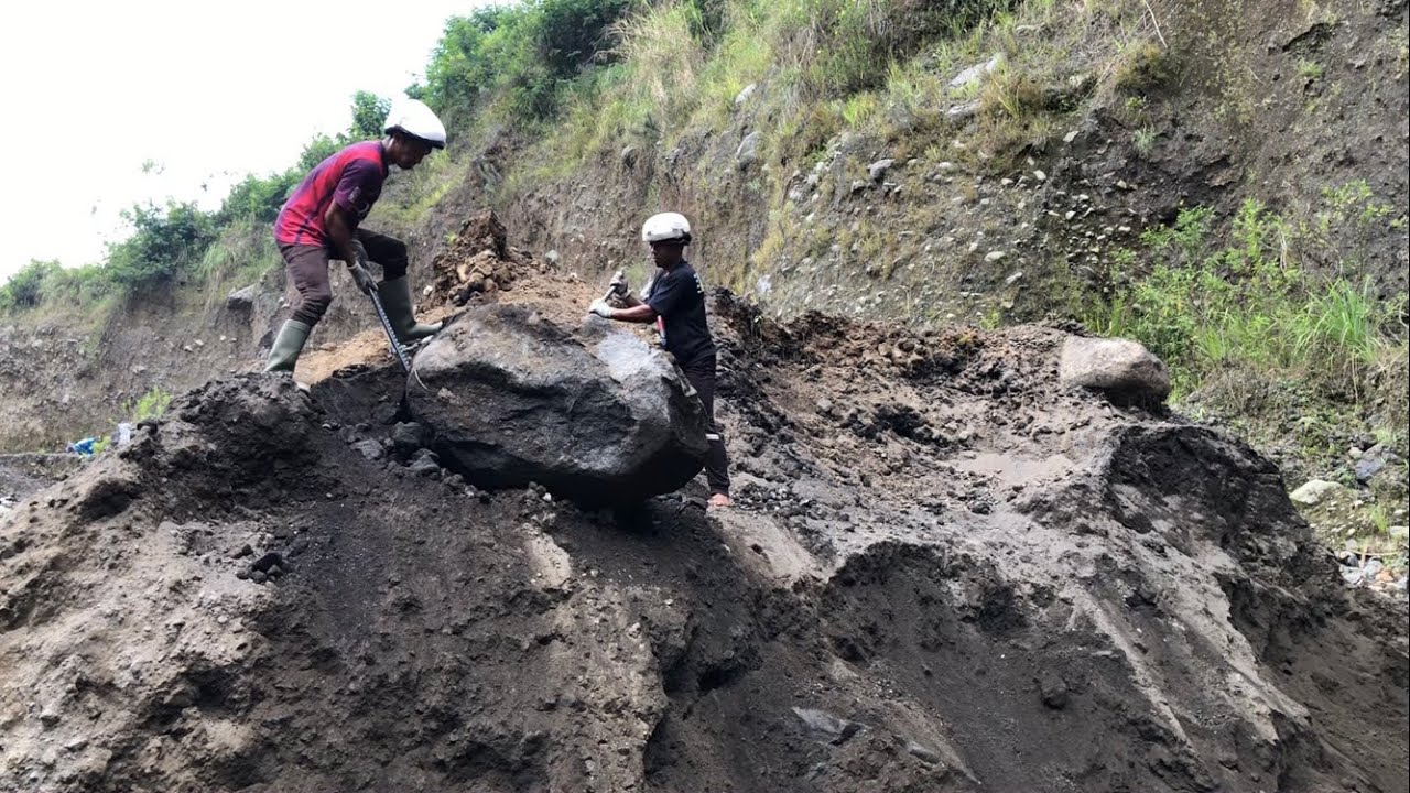 teamwork of the miners mining sand and dropping big stone - YouTube