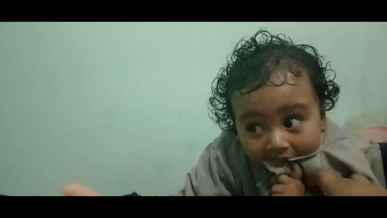 mama is distracting baby from eating clothes - YouTube