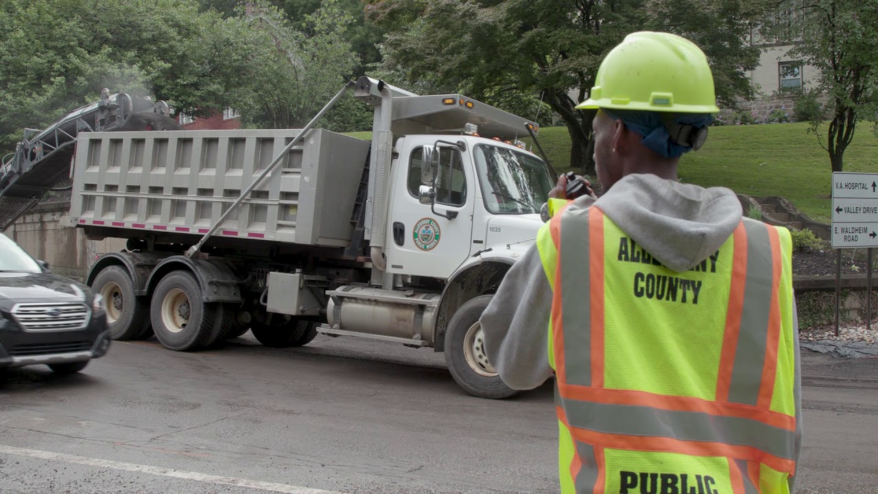 Public Works Fixes Delafield Road After Storm - YouTube