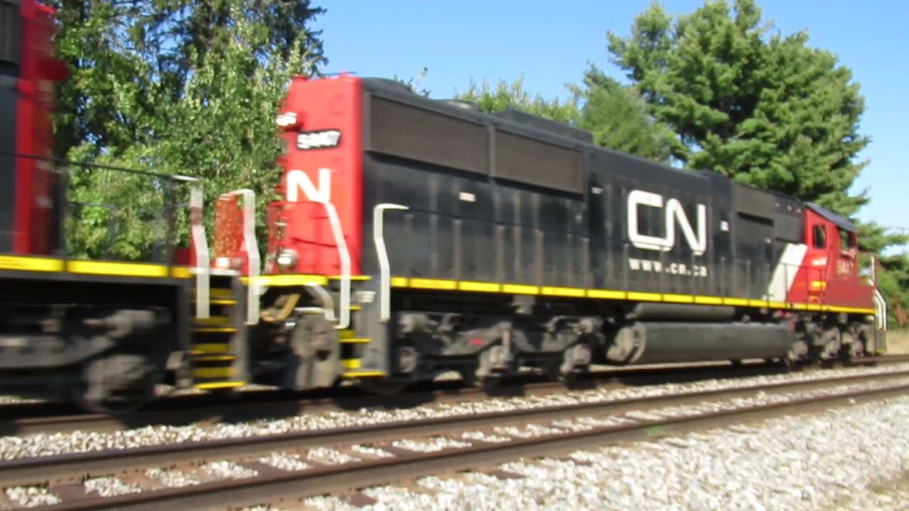 CN 5447, 5346 hustle a short Eastbound local freight train past ...