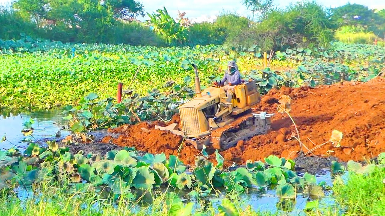 Just Amazing.! The Mini Dozer Building The Road Through The Muddy Water ...