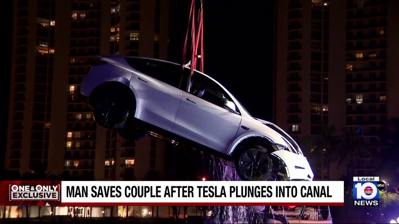 Couple rescued after Tesla ended up in Sunny Isles Beach canal - YouTube