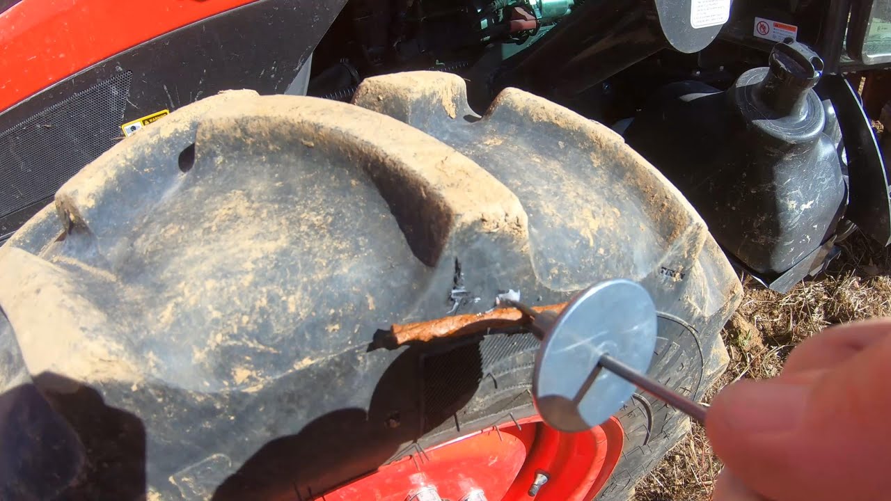 Field repair of tractor tire; TWO Punctures - YouTube