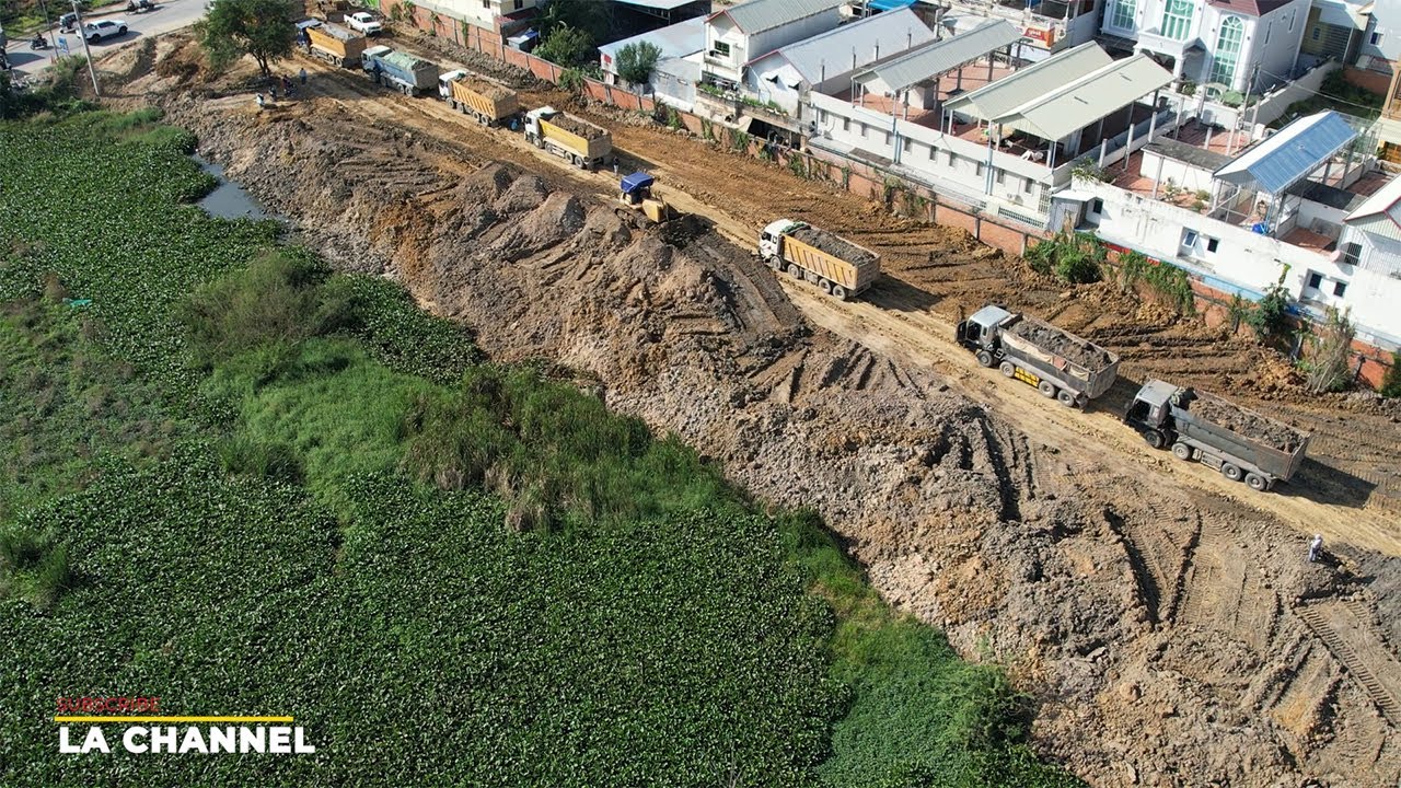Land Filling Up Process A Lot Of Dump Truck Unloading And Smart ...